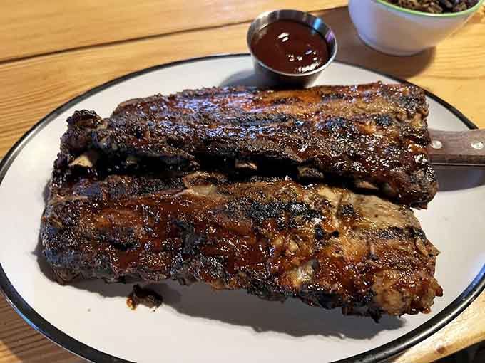 These ribs look like they've been kissed by smoke and slathered with love, falling-off-the-bone tender.