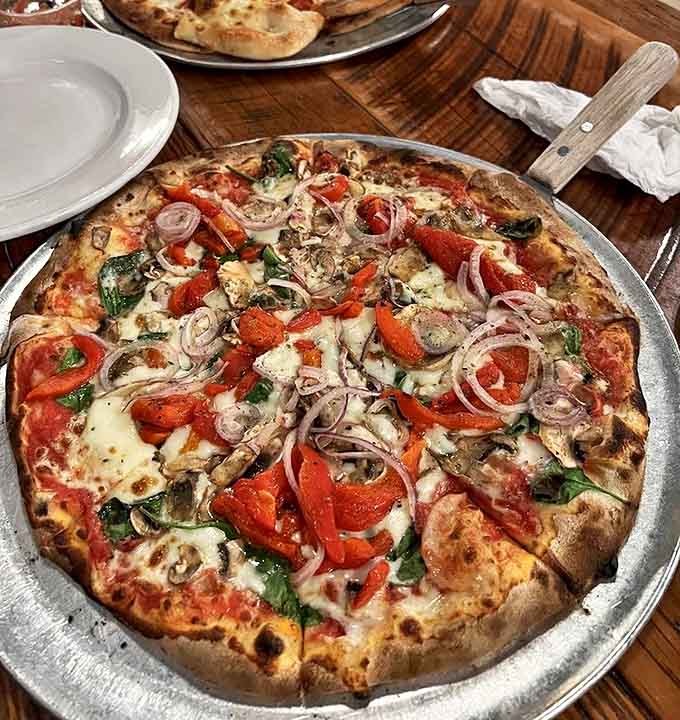 Loaded with fresh vegetables and melted cheese, this pizza proves that meatless options can absolutely steal the show at any table.