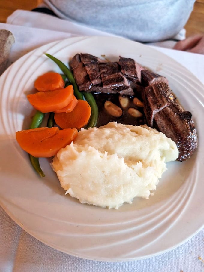 Vermont's bounty on full display &ndash; perfectly cooked venison medallions share the plate with garden-fresh vegetables and cloud-like mashed potatoes.