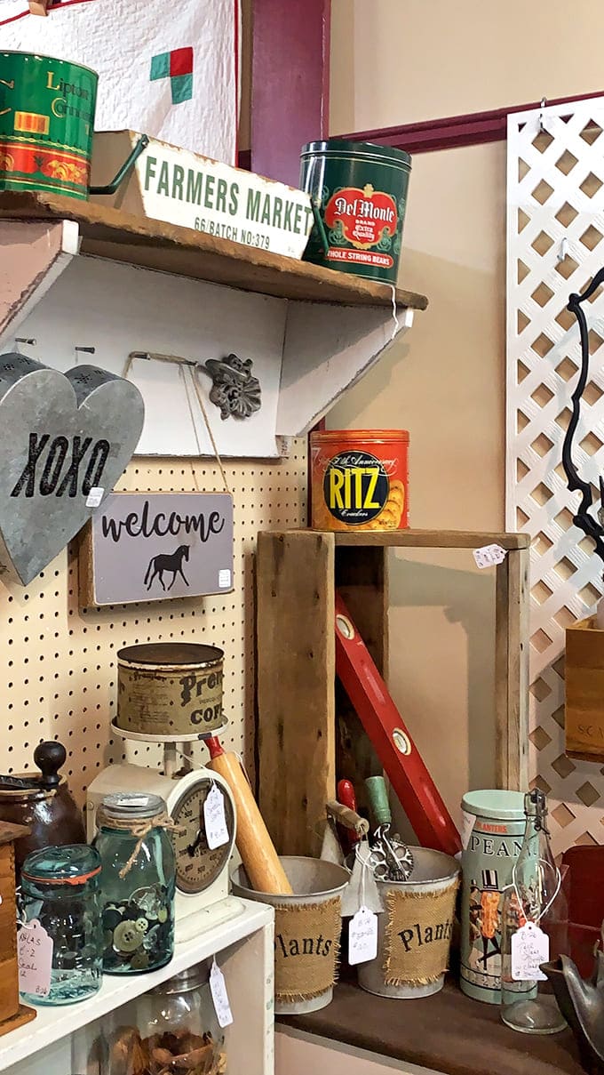 Vintage tins and farmhouse finds transport you to grandma's kitchen, where Del Monte cans and Farmers Market signs once adorned wooden shelves.