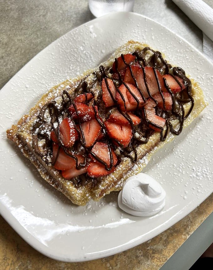 Fresh strawberries and Nutella transform a simple waffle into a dessert that's somehow acceptable at 9 AM, and we're not complaining.