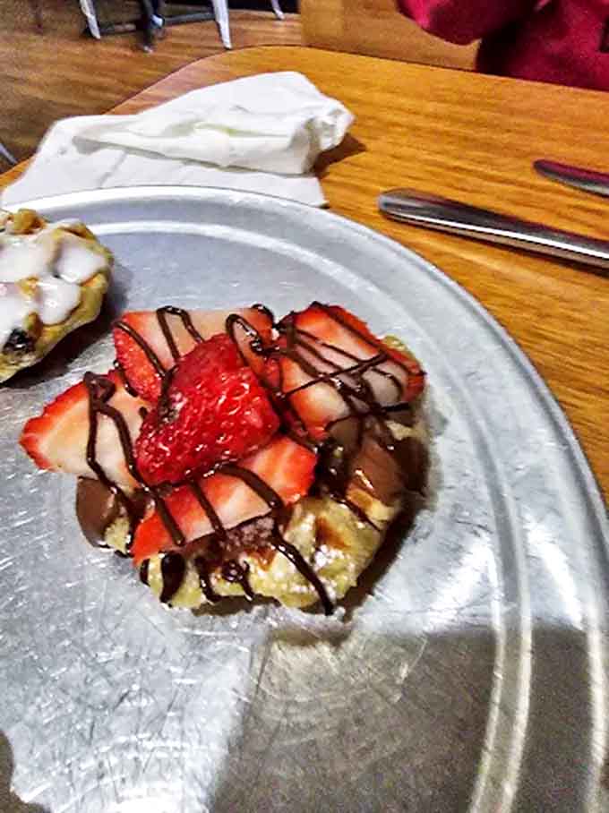 Strawberry Waffle: Fresh strawberries and chocolate drizzle transform this waffle into edible art &ndash; the kind that makes you pause before demolishing it in record time.