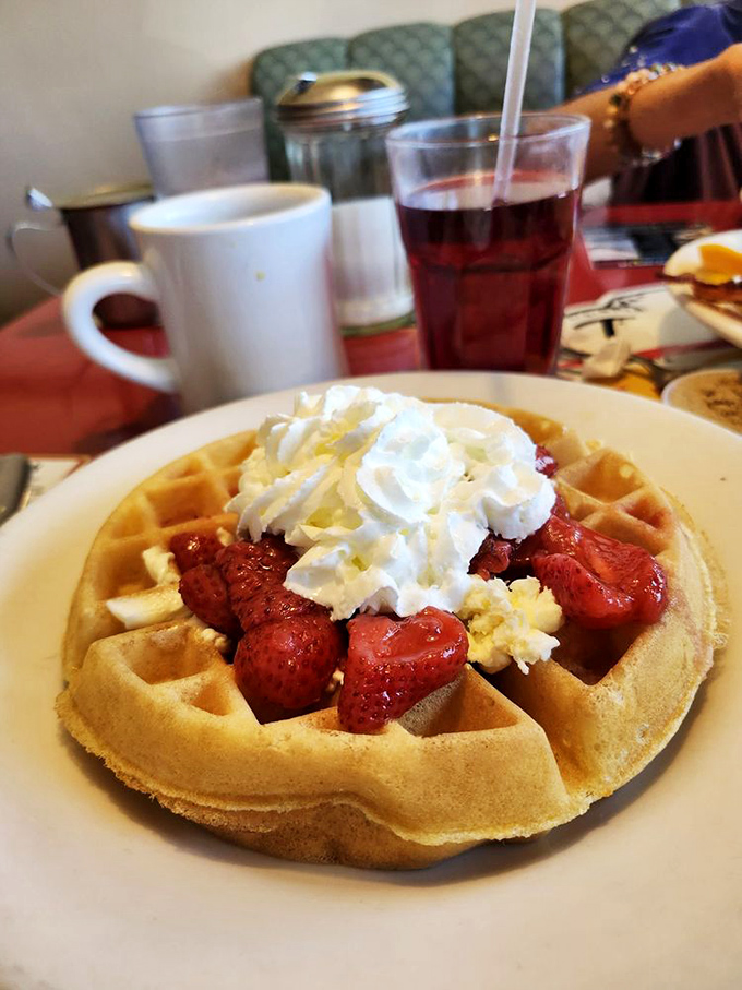 Waffle: A perfect grid of crispy exterior and fluffy interior, crowned with strawberries and whipped cream &ndash; breakfast masquerading as dessert.
