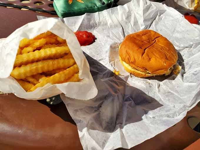 The crinkle-cut fries bring that nostalgic texture while the cheeseburger delivers on every promise a good burger should make.