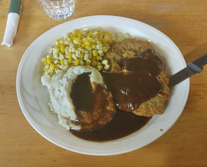 That chicken fried steak with gravy could make a vegetarian reconsider their life choices, served with corn and mashed potatoes.