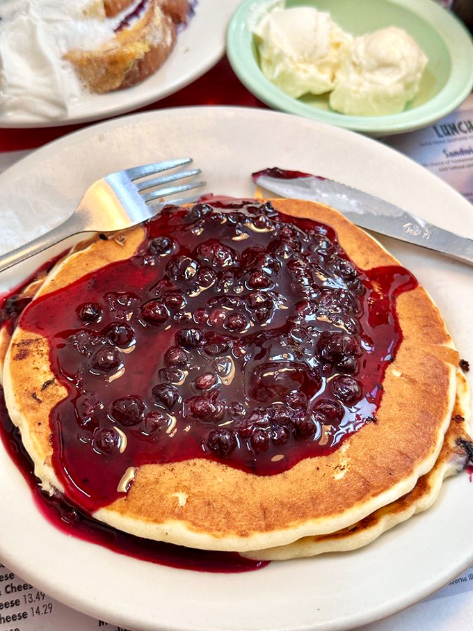 Wild Maine blueberry pancakes that make you question every other pancake you've ever eaten &ndash; tiny berries, explosive flavor, pure breakfast joy.