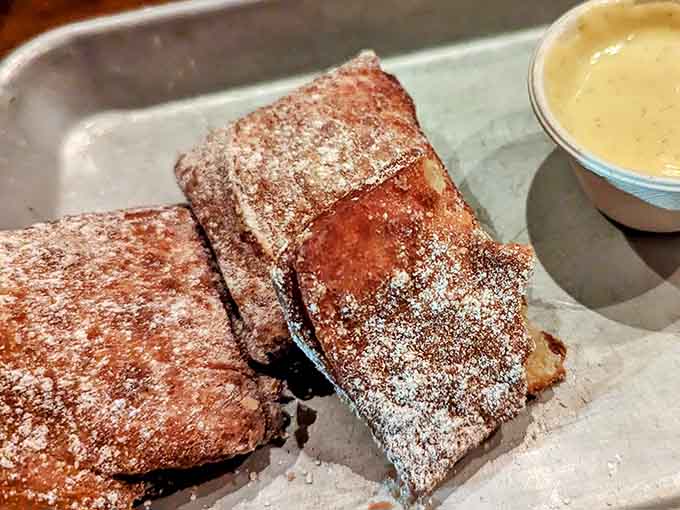 Golden, crispy, and generously coated in cinnamon sugar, these beauties are still warm from the fryer and ready to rock your world.