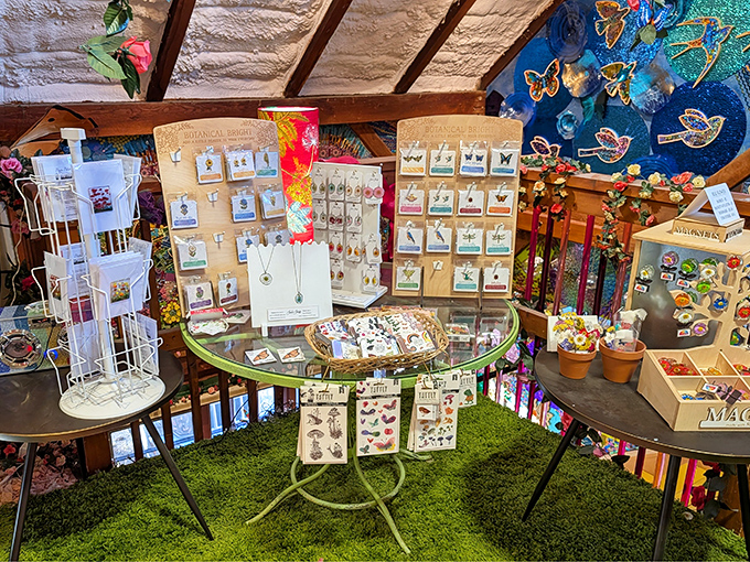 Artisan displays showcase delicate handmade jewelry &ndash; each piece whispering tales of Vermont craftsmanship and creative passion.