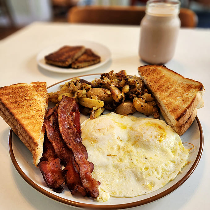 Bacon and Egg: The breakfast classic reimagined &ndash; crispy bacon, perfectly cooked eggs, and potatoes that deserve their own fan club.