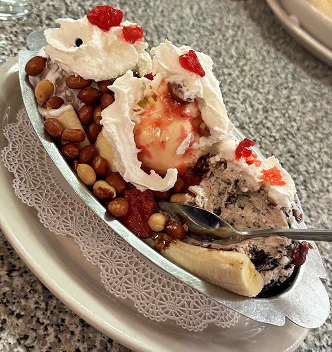 Texture paradise: crunchy nuts complement smooth ice cream and sliced bananas in this masterpiece that's worth every calorie and moment of indulgence.