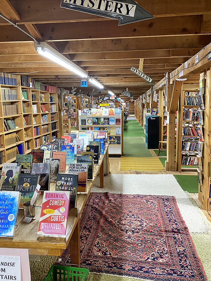 Follow the "Mystery" signs through literary labyrinths where over 200,000 books await, organized in delightfully unpredictable categories.