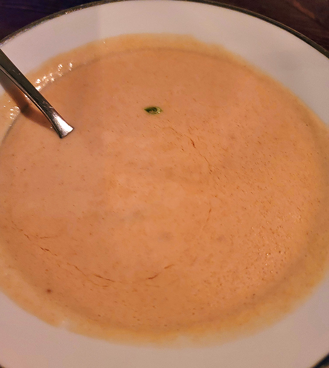 Each spoonful of the bisque reveals layers of flavor &ndash; sweet lobster meat, subtle sherry, and a silky texture that makes time stand still.