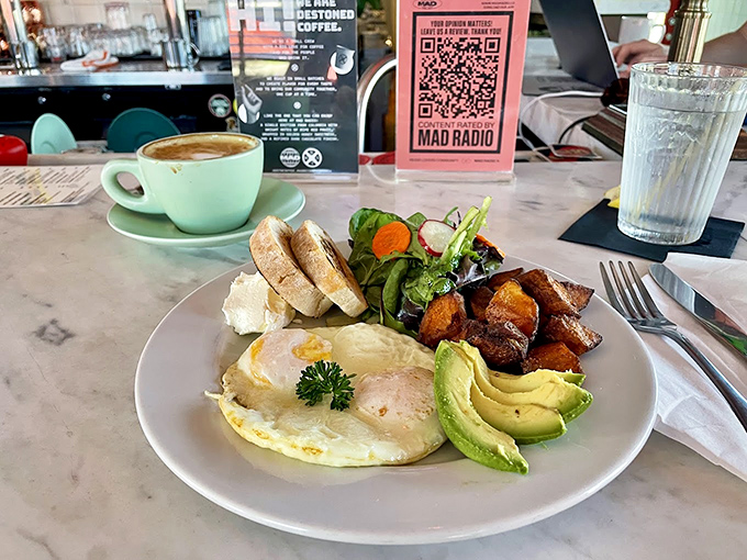 Breakfast of champions: sunny-side up eggs, creamy avocado, and roasted potatoes create morning magic that's worth setting an alarm for.