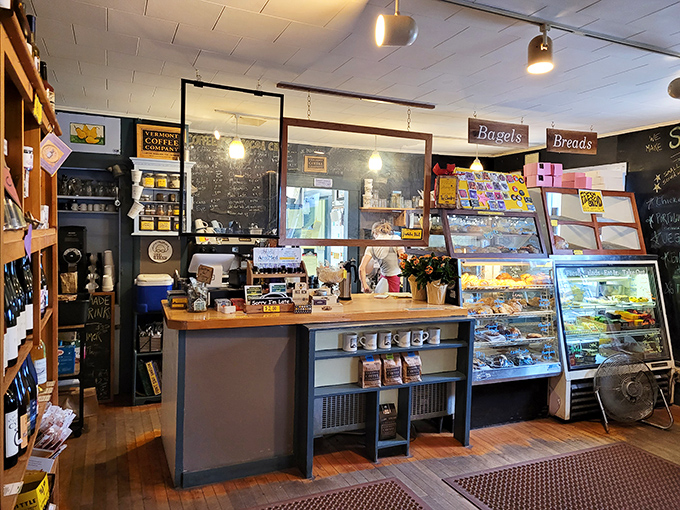 The bakery counter stands as a monument to temptation, where coffee aromas mingle with the scent of fresh-baked treats.