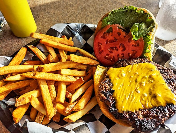 A proper diner cheeseburger should require both hands and several napkins &ndash; this golden-brown masterpiece with hand-cut fries delivers on that promise.