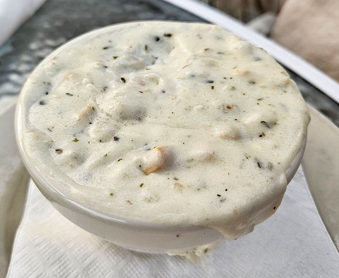 New England clam chowder that achieves the impossible balance &ndash; creamy without heaviness, packed with tender clams and potatoes in a harmonious seafood symphony.