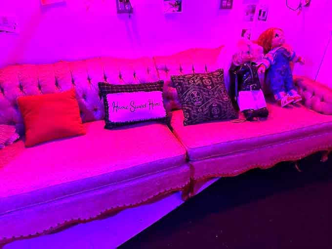 "Home Sweet Home" indeed &ndash; this pink-lit vintage couch creates an unsettling domestic scene that's both familiar and deeply wrong.