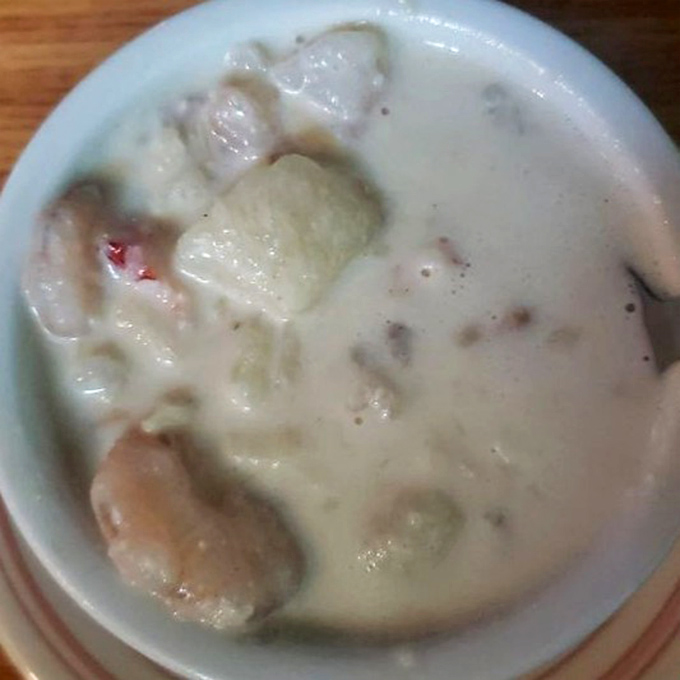 Maine's maritime bounty transformed into velvety perfection &ndash; each spoonful delivers chunks of seafood swimming in a broth that whispers of butter and sea.