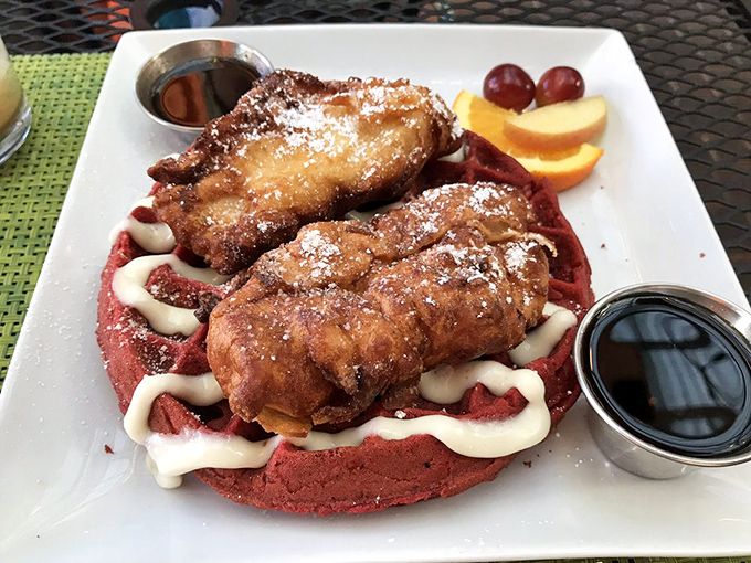 The perfect bite awaits &ndash; crispy, juicy chicken meets fluffy red velvet waffle in a sweet-savory marriage made in breakfast heaven.