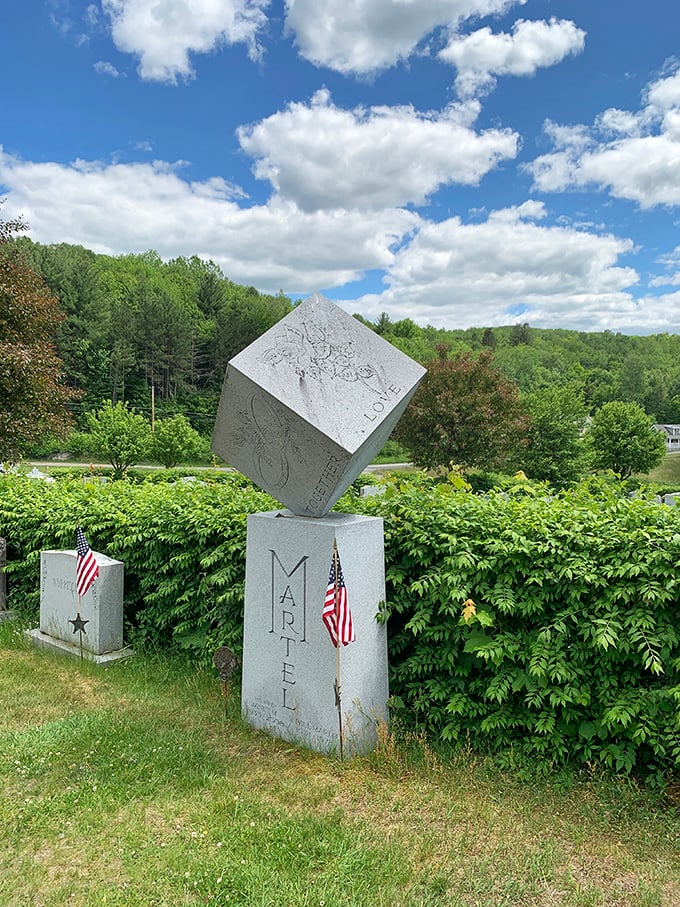 Balanced precariously on one corner, this cube-shaped monument defies gravity and conventional memorial design.