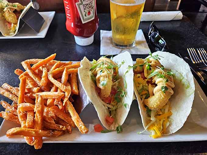A plate of pure joy: crispy tacos alongside golden-fried mushrooms &ndash; proof that sometimes the best things in life come battered and fried.