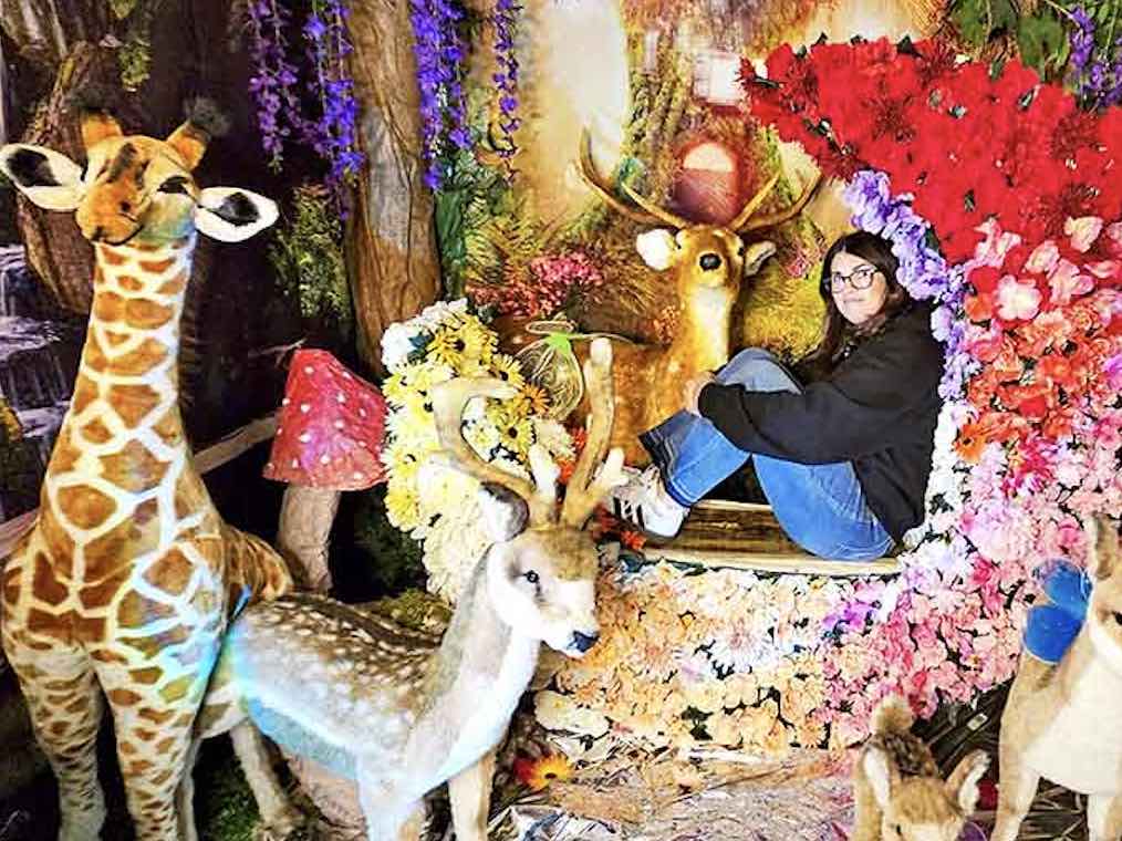 Wild imagination comes to life in the safari-themed corner where woodland creatures pose among vibrant flowers and lush greenery.