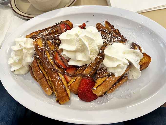 French Toast with Strawberries & Cream: Breakfast or dessert? The line blurs deliciously with this cloud-like creation topped with fresh berries and pillowy cream.