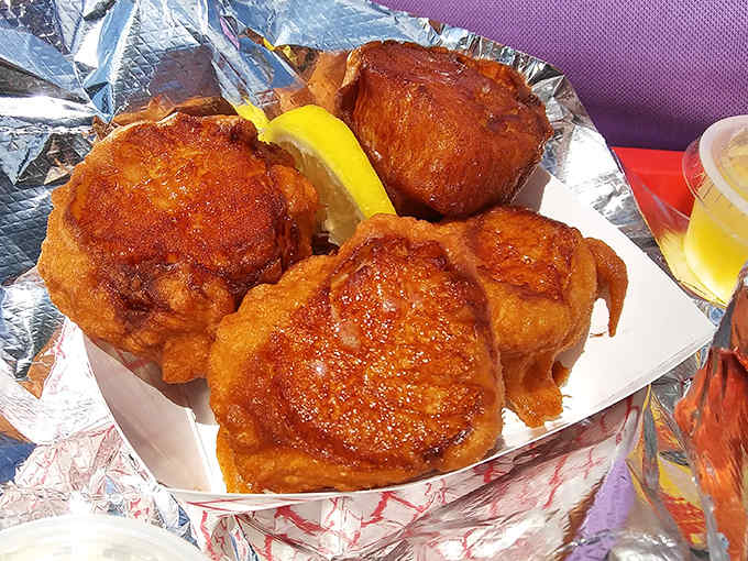 The perfect bite: sweet Maine scallops in their golden jackets, with just a squeeze of lemon to brighten their natural flavor.