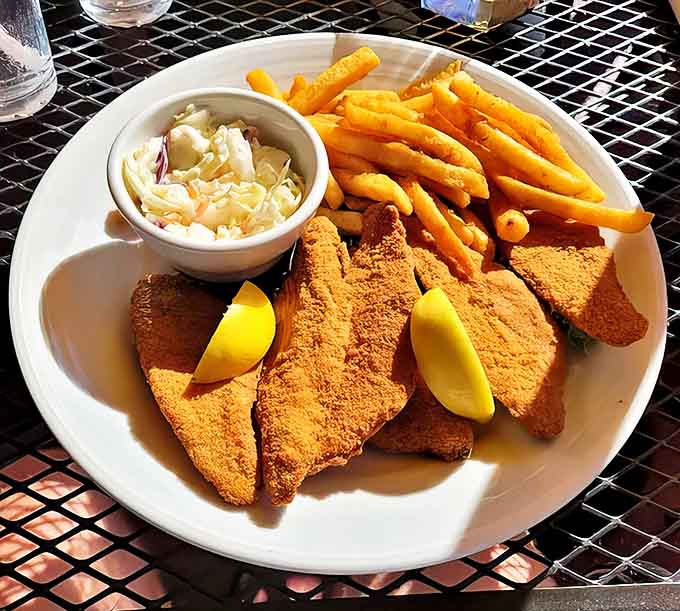 Golden-brown walleye with a satisfying crunch giving way to tender, flaky goodness inside &ndash; paired with crispy fries and house-made coleslaw.