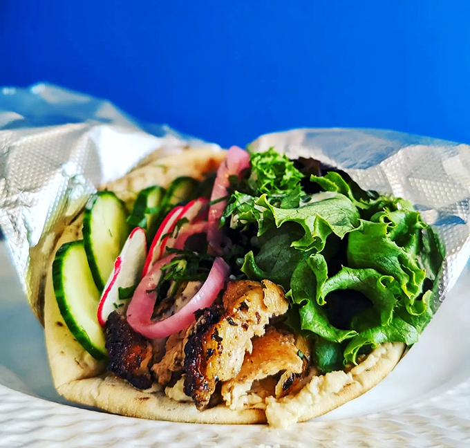 Fresh greens, crisp vegetables, and that signature tahini sauce come together in a wrap that somehow manages to be both light and satisfying.