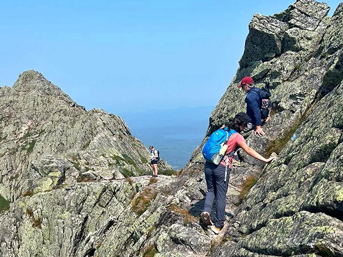Hikers navigate the rocky spine of Katahdin's famous trails, where each step brings new perspectives and minor cardiovascular events.