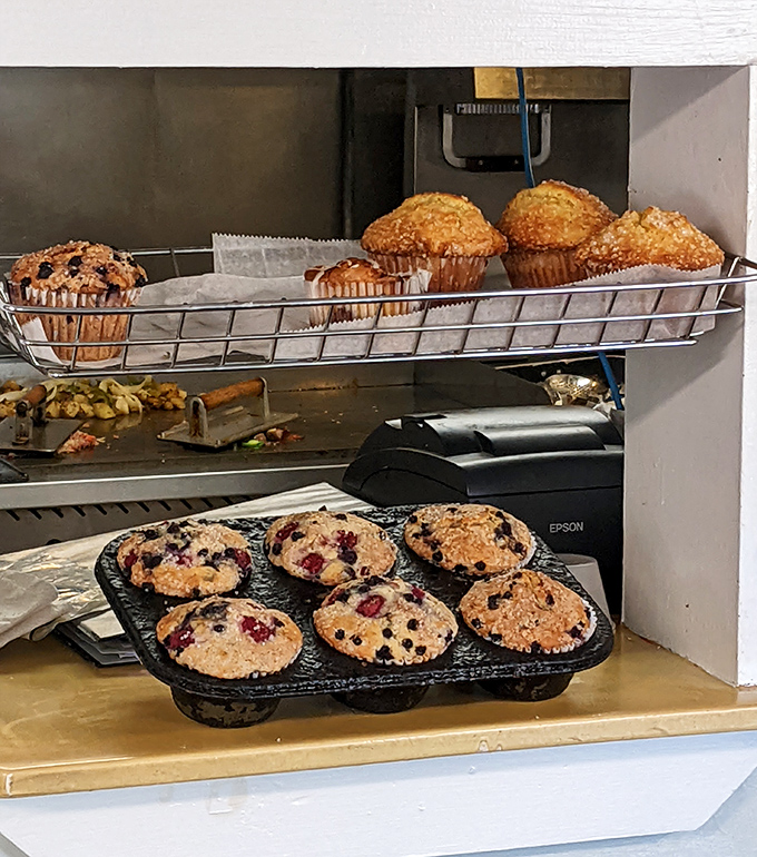 Fresh muffins cooling in their baskets, their domed tops and studded berries promising the kind of breakfast that makes getting out of bed worthwhile even on difficult mornings.