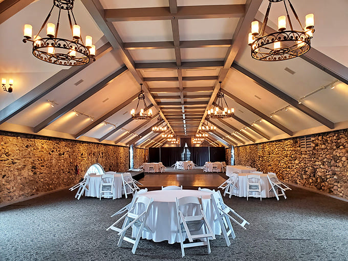 Medieval meets modern under these spectacular iron chandeliers, casting a warm glow that makes everyone look like royalty.