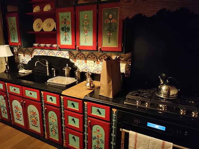 A kitchen where even the cabinets wear more decorative detail than most people's entire houses, proving function can be fabulous.