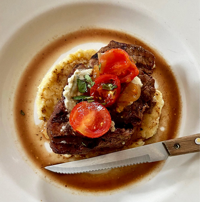 Meat lovers, rejoice! This steak isn't just a meal, it's a carnivore's dream come true, perched atop a cloud of mashed potato heaven.