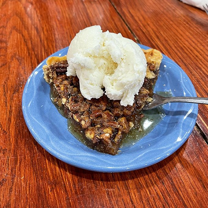 Heaven on a blue plate: Warm pecan pie crowned with cool vanilla ice cream creates the desert's most perfect temperature contrast.
