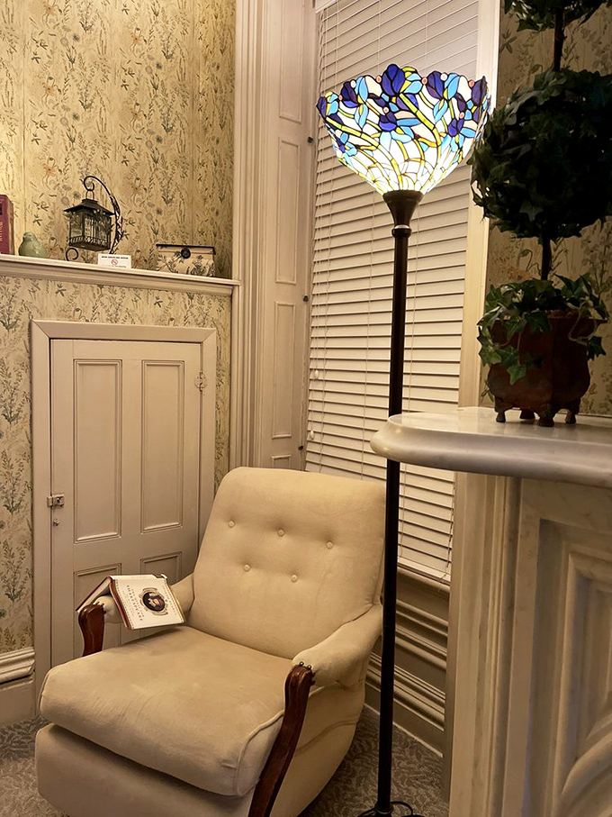 A cozy reading nook complete with Tiffany-style lamp creates the perfect spot to lose yourself in a book or quiet contemplation.