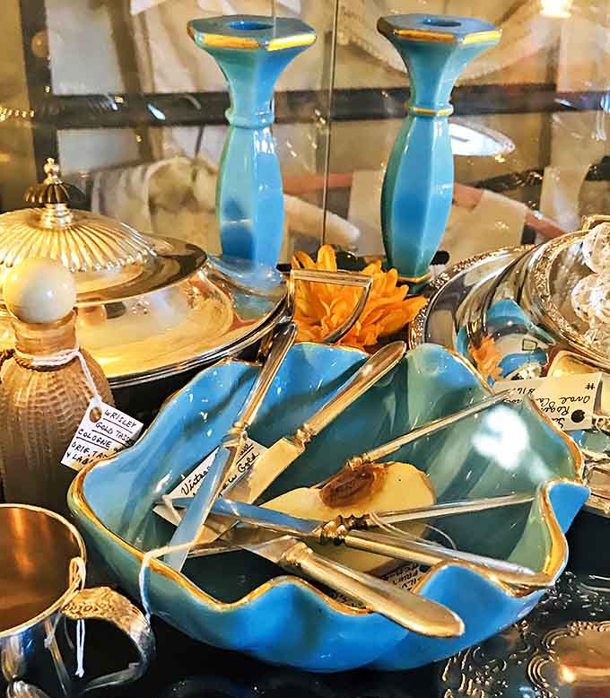 Delicate blue ceramic bowls trimmed with gold edges wait patiently for someone who appreciates their vintage charm.