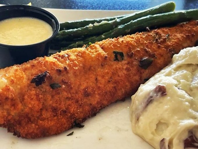 Golden-crusted perfection meets creamy indulgence. This walleye dish is so good, it might just convince fish skeptics to jump in the deep end.