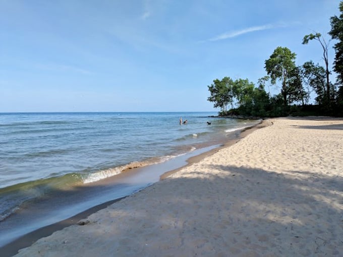 Sunset paints the sky in vibrant hues, reflecting off the calm lake. Nature's own light show, no tickets required!