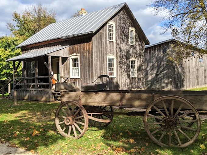 Wagon wheels and wooden wonders! This rustic scene is like stepping into a sepia-toned photograph.