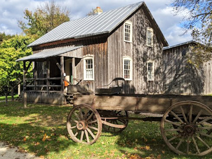 Wagon wheels and wooden wonders! This rustic scene is like stepping into a sepia-toned photograph.