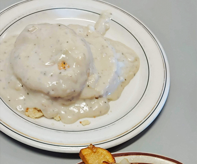 Close-up of the star attraction &ndash; a golden biscuit drowning happily in gravy that's thick enough to coat a spoon but smooth enough to make you swoon.