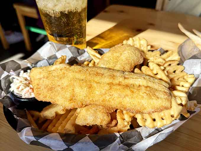 Fish and chips done right means crispy batter, tender fish, and enough fries to share, though you probably won't want to.