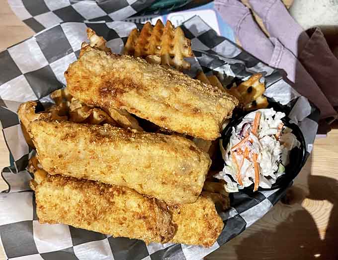 Fish and chips with coleslaw: the holy trinity of lakeside dining, served with a view that makes everything taste even better.