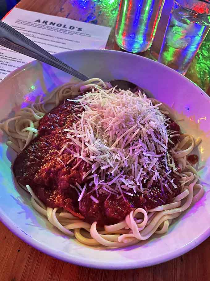 Spaghetti and meatballs done right &ndash; al dente pasta swimming in rich tomato sauce, crowned with a mountain of freshly grated cheese.