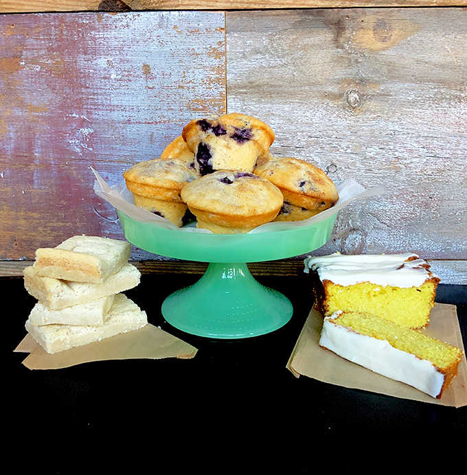 A joyful trinity of treats: golden blueberry muffins, shortbread squares that practically melt on contact, and lemon cake that brightens even the cloudiest Cleveland day.