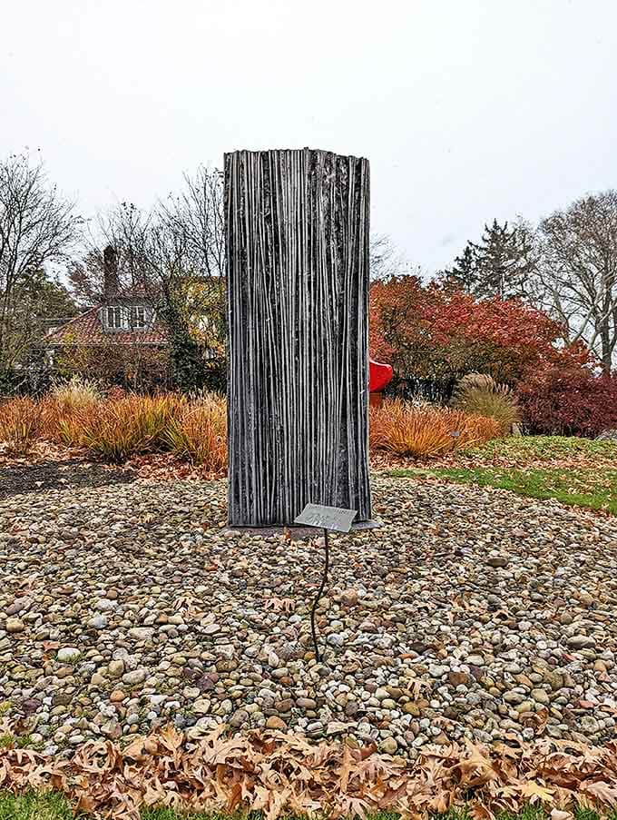 Vertical lines reach skyward in this textured pillar, its weathered surface recording time's passage like nature's own journal.