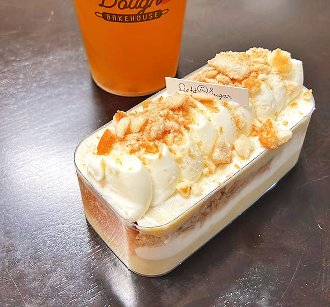 Banana Pudding: Layers of creamy nostalgia topped with crumbled cookies &ndash; like a Southern grandmother's hug transformed into dessert form.