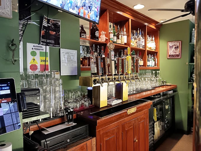 Behind this well-worn wooden bar, local brews and spirits stand ready like old friends waiting to make your acquaintance.